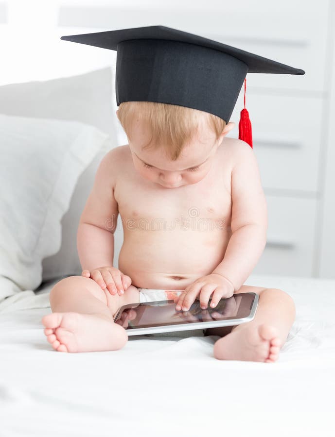 Beautiful Baby in Graduation Cap Using Digital Tablet Stock Photo ...