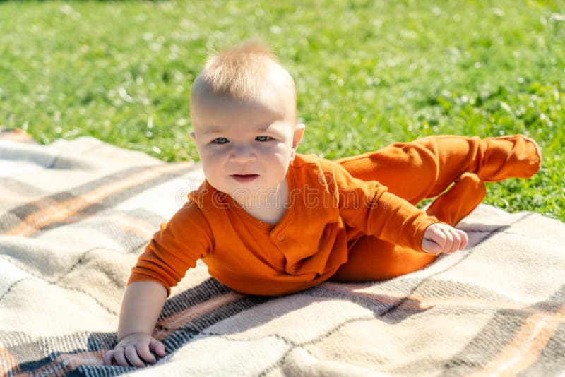 Beautiful Baby Lying on the Plaid on Sunny Grass Stock Image - Image of ...