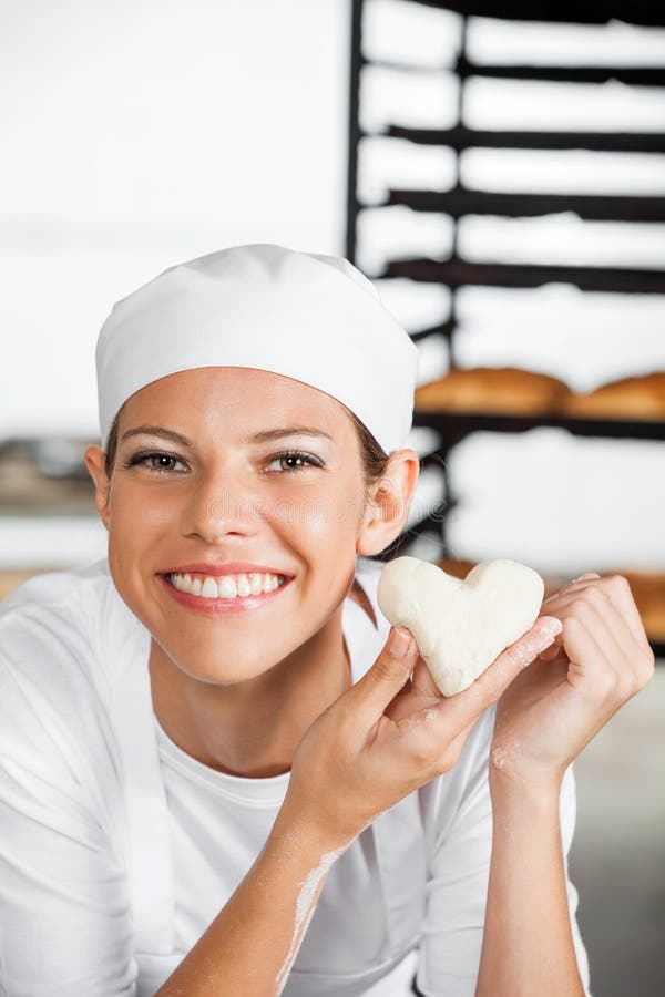 Beautiful Baker Holding Heart Shape Dough in Bakery Stock Photo - Image ...