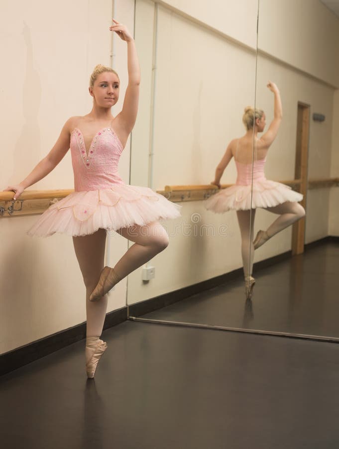Beautiful Ballerina Standing En Pointe with the Barre Stock Photo ...