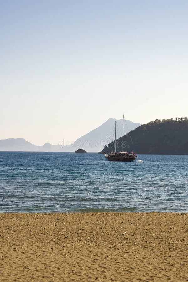 Beautiful beach with boat stock image. Image of scenics - 4427197
