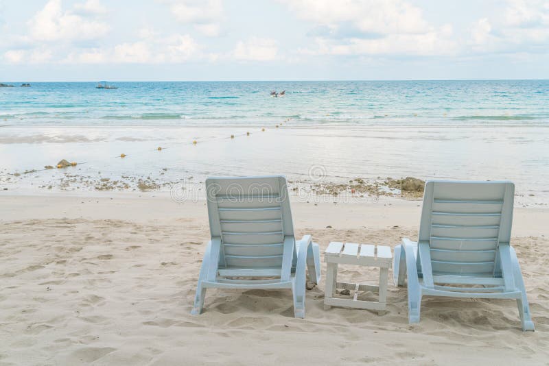 .Beautiful Beach Chairs on Tropical White Sand Beach Stock Photo ...