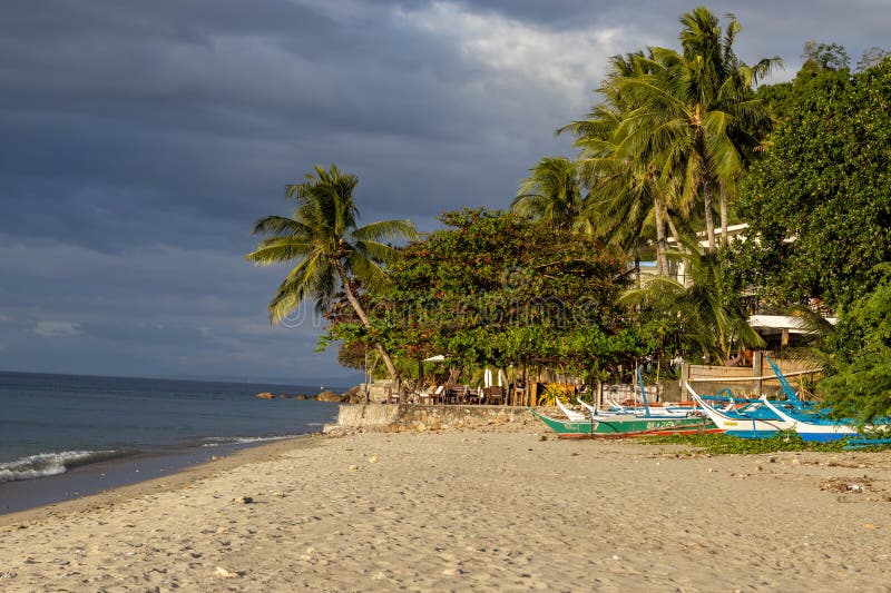 A Beautiful Beach with a Hotel on the Shore at Sunset. Stock Image ...