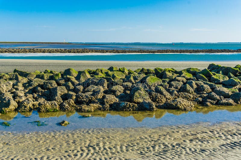 Beautiful Beach Landscape with a Line of Rocks Stacked Stock Photo ...