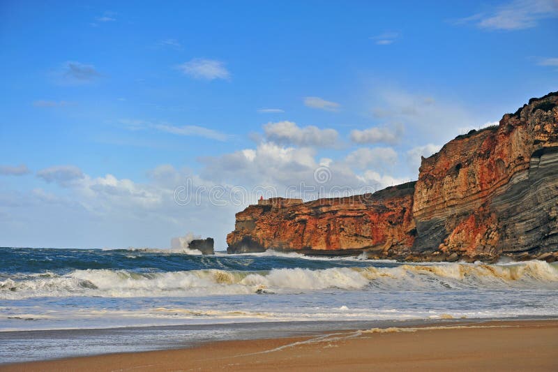 Beautiful Beach of Nazare with Lighthouse on Cliffs Stock Image - Image ...