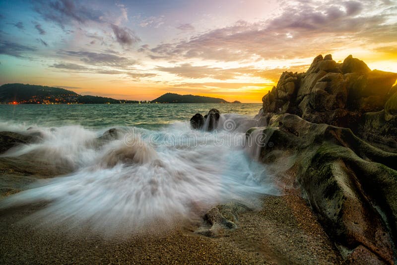 Beautiful beach sunset. stock photo. Image of rocks, natural - 75366144