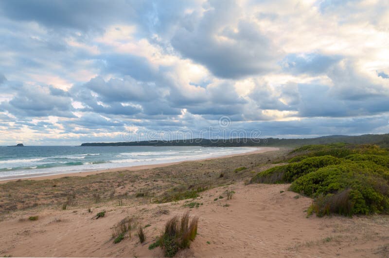 Beautiful Beach Sunset with Sunlit Clouds and Empty Beach Stock Image ...