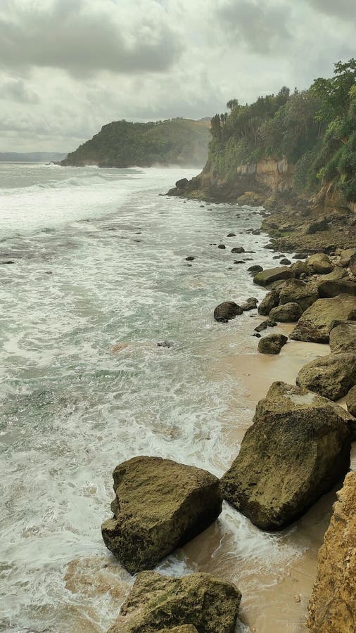 Beautiful Beach Wallpaper with Large Rocks, this is in Indonesia Stock ...