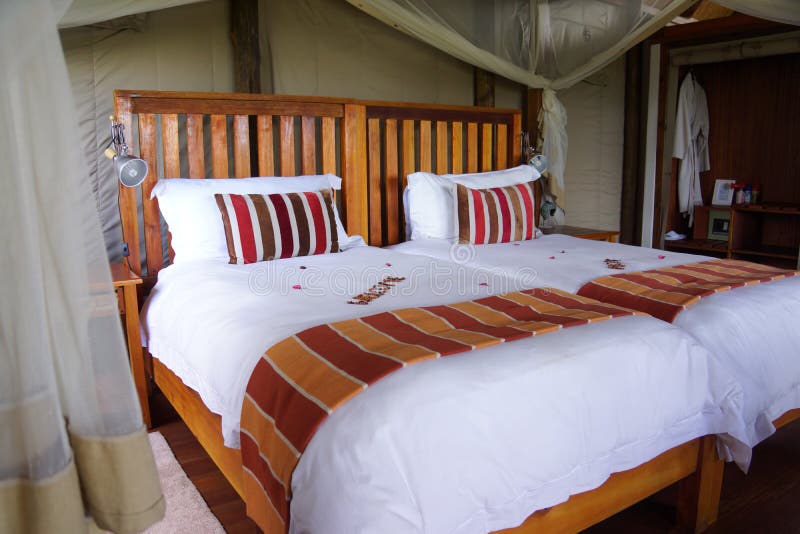 Beautiful bed in a lodge stock photo. Image of comfort - 81472548