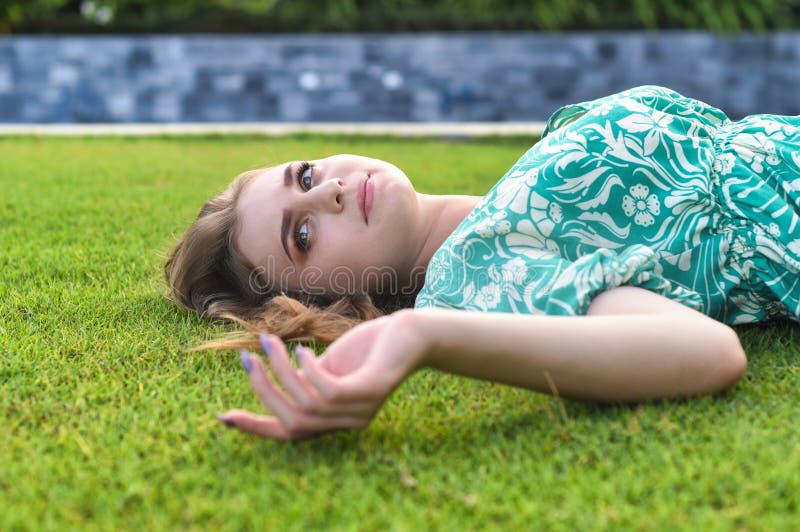 Beautiful Belarus Woman Laying on the Grass Stock Photo - Image of ...