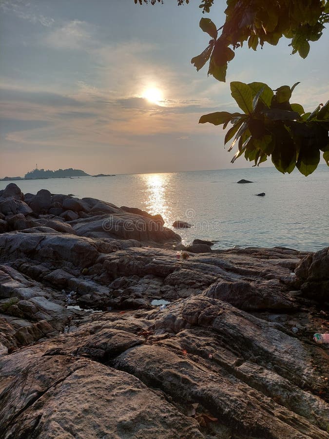 Beautiful Big Rocks Beach with Sunset Reflection Stock Photo - Image of ...