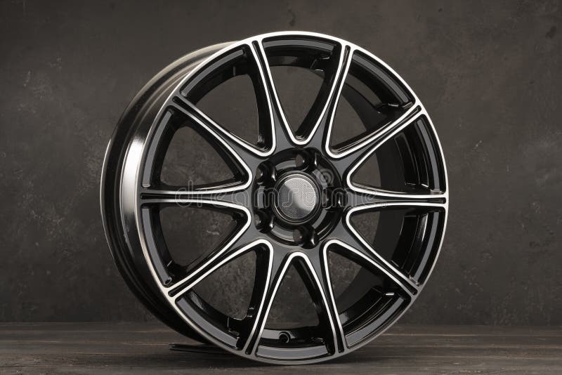 Beautiful Black Alloy Wheel New on a Gray Background. Stock Image ...