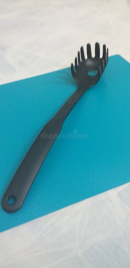A Beautiful Black Serving Spspoon. Stock Photo - Image of dining, hand ...