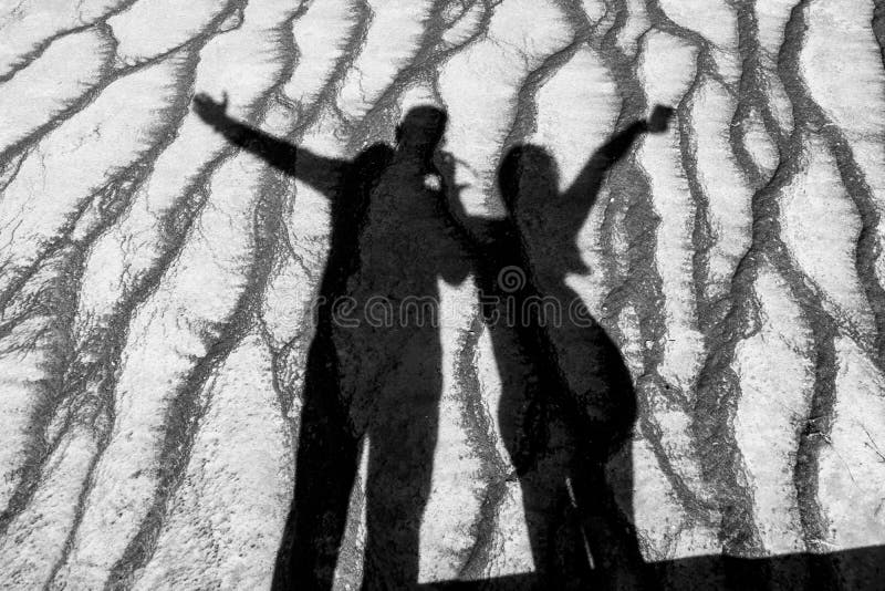 Beautiful Black and White Shot of the Shadow of a Couple on a Ground ...