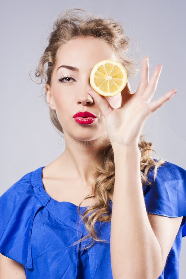 Beautiful blond with lemon stock photo. Image of girl - 23795728