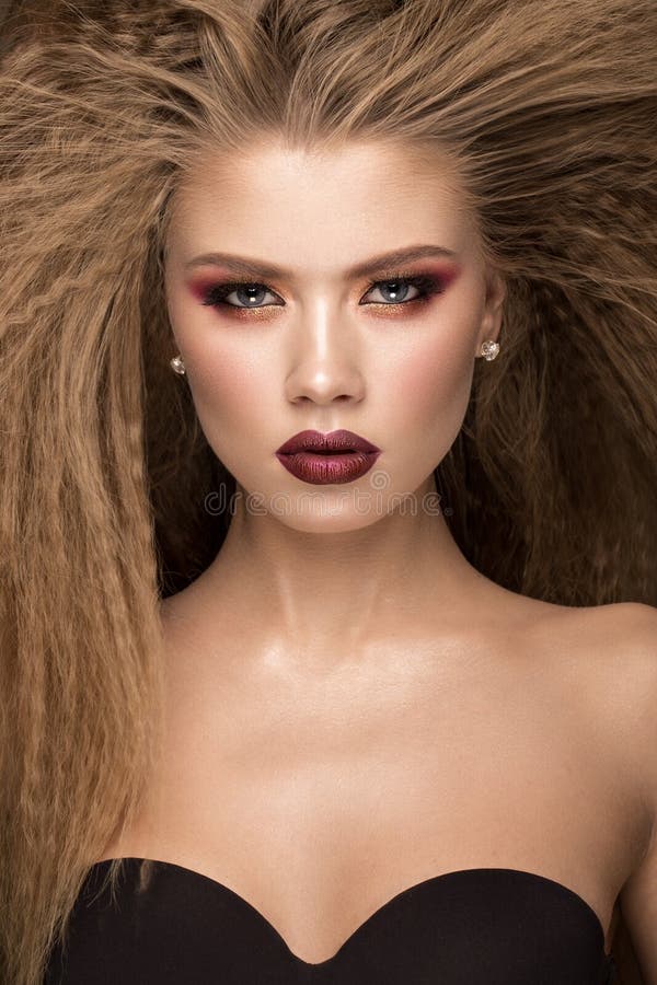 Beautiful Blond Model Curls Bright Makeup Gold Jewelry And Red Lips