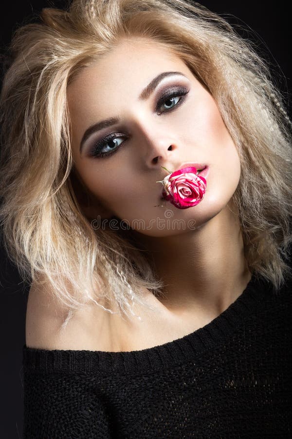 Beautiful Blonde In A Hollywood Manner With Curls Natural Makeup And