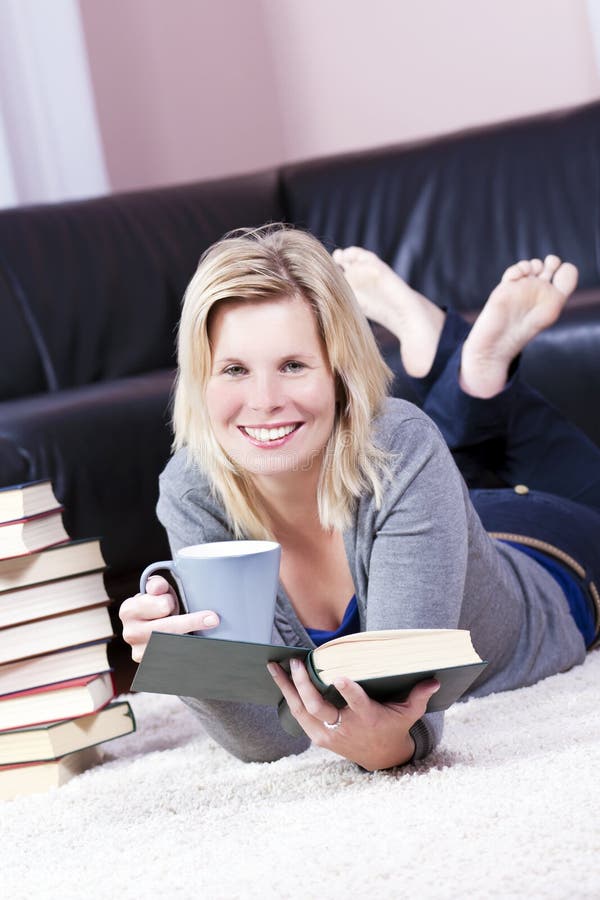 Beautiful Blonde Girl Happily Reading. Stock Photo - Image of blond ...