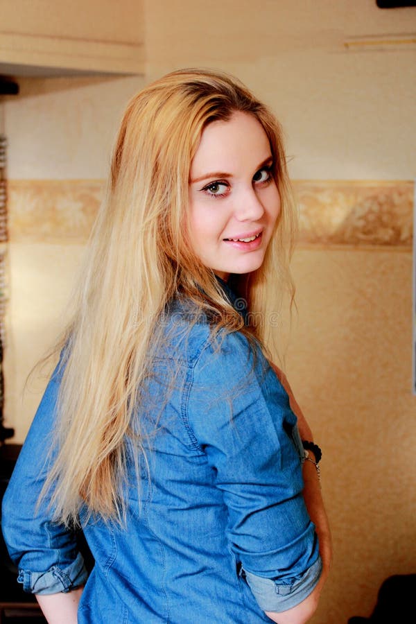 Beautiful Blonde Half-turned Affectionately Looks Back at Us. Stock ...