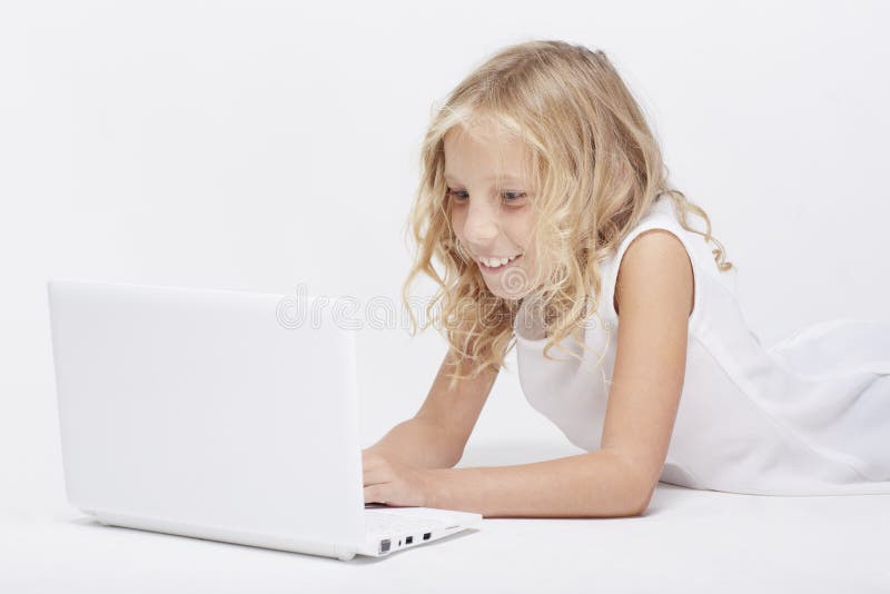 Beautiful Blonde Little Girl in White, Computer Stock Photo - Image of ...
