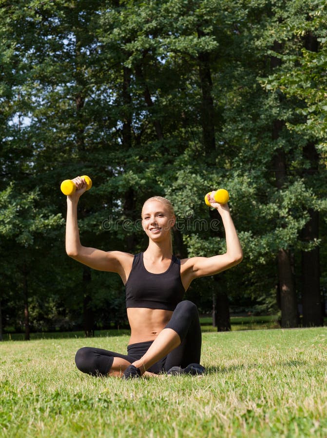 The Beautiful Blonde in Park with Dumbbells Stock Image - Image of arms ...