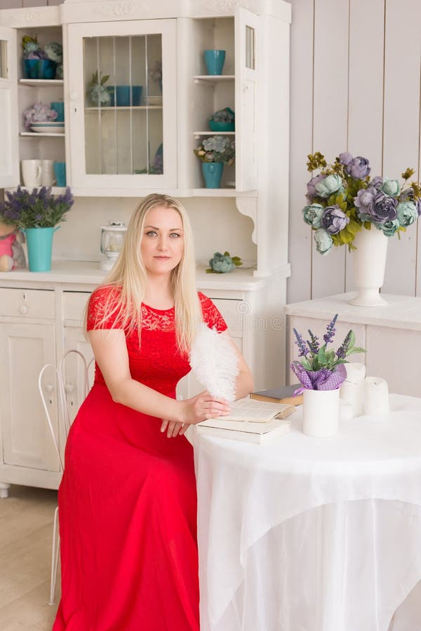 The Beautiful Blonde in a Red Dress in the Studio Stock Photo - Image ...
