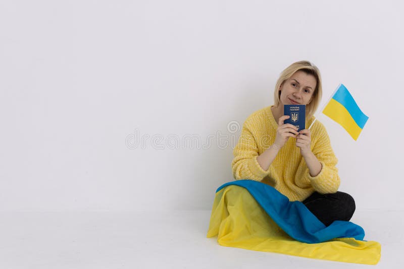 Ukrainian Girl With The Flag Of Ukraine And A Passport A Girl Holds A
