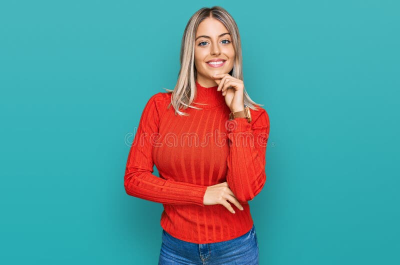 Beautiful Blonde Woman Wearing Casual Clothes Looking Confident At The