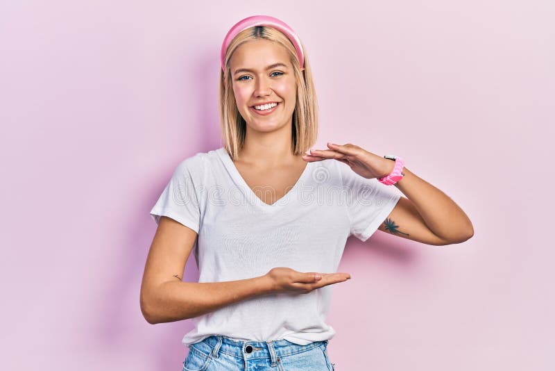 Beautiful Blonde Woman Wearing Casual White T Shirt Gesturing With
