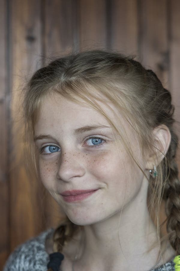 Beautiful Blonde Young Girl With Freckles Outdoors On Nature Background