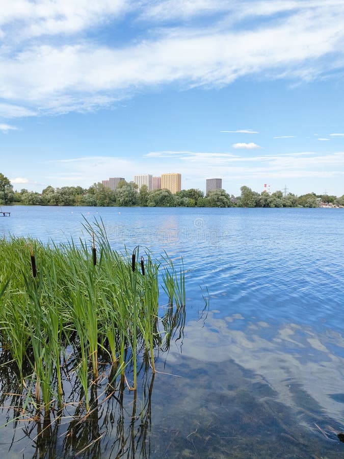 A Beautiful Blue Lake on the Outskirts of the City and the Clouds ...