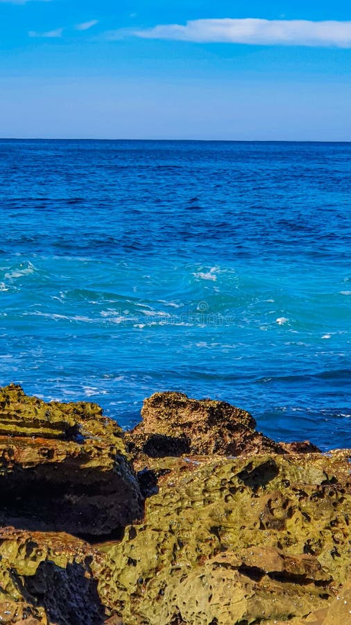 Beautiful Blue Ocean with Rocks in the Foreground Stock Image - Image ...