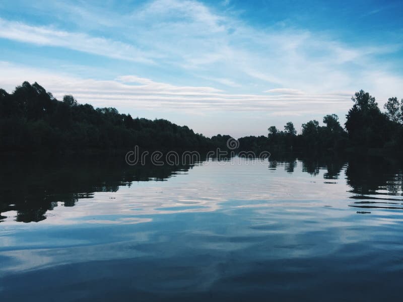 Beautiful Blue River with Reflecting Clouds in the Water in the Middle ...