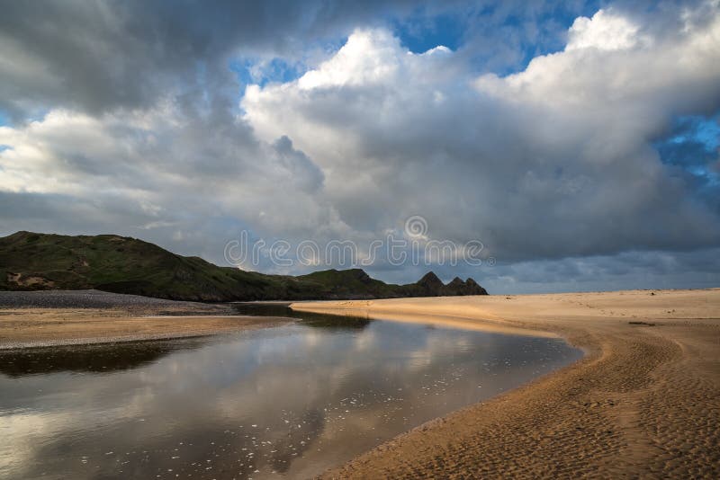 Beautiful Blue Sky Morning Landscape Over Sandy Three Cliffs Bay Stock ...