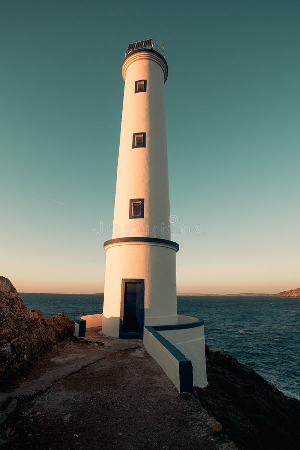 A Beautiful Blue and White Lighthouse during a Sunny Bright Day in the ...