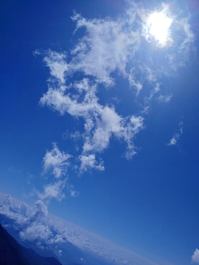 Beautiful Blue and White Sky with Bluer Sun Stock Image - Image of blue ...
