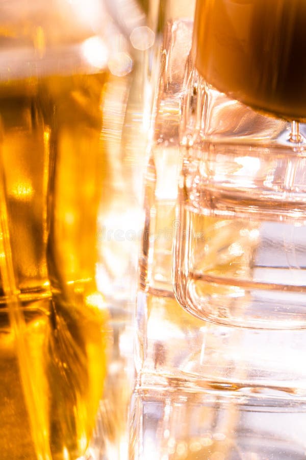 Beautiful Bokeh and Light Reflections in Yellow Glass Perfume Bottles ...