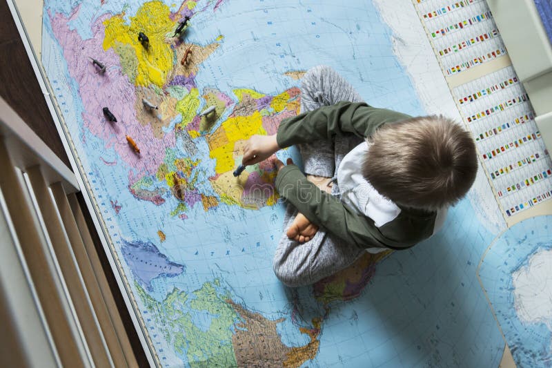 Beautiful Boy Lies on a World Map Stock Photo - Image of child ...