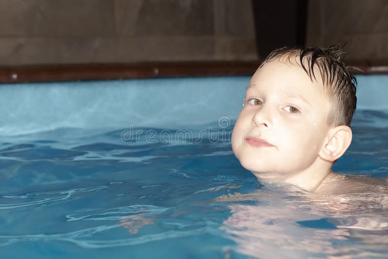 A Beautiful Boy Swims in Pool, Water Stock Image - Image of play ...