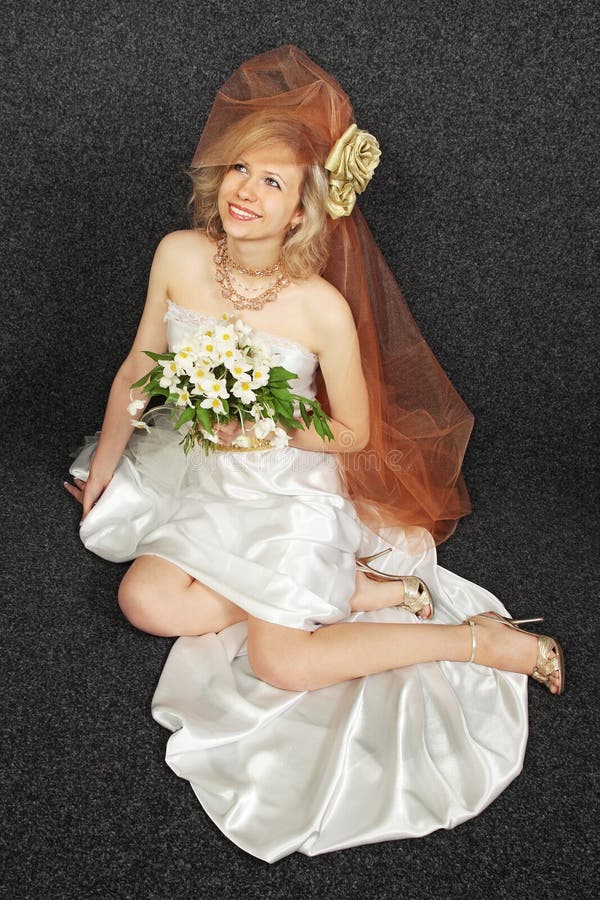 Smiling Bride Setting the Garter Stock Photo - Image of fianc ...