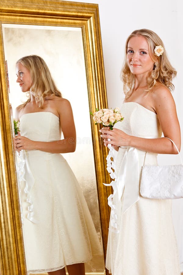 Beautiful Bride at the Mirror Stock Photo - Image of adult, cosmetics ...