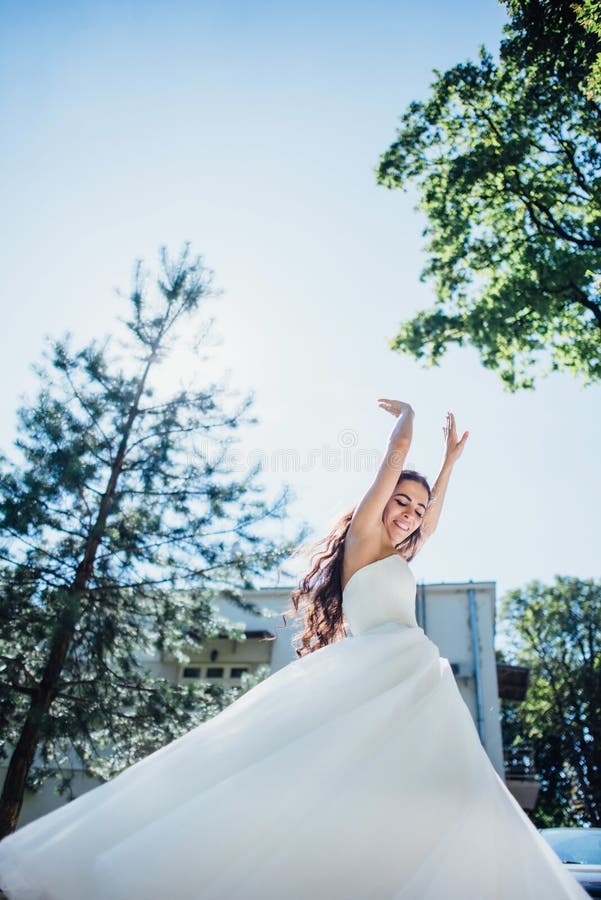 Beautiful bride dancing stock photo. Image of kiss, iris - 79679832
