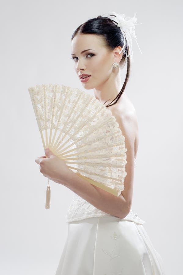 Beautiful bride with a fan stock image. Image of hair - 34824669