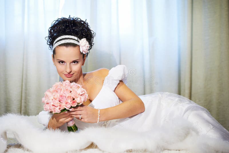 Beautiful Bride with Flowers on White Bed Stock Image - Image of bride ...
