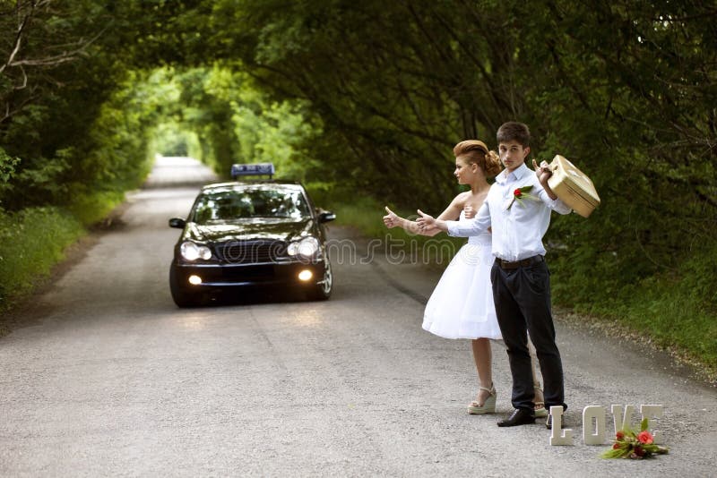 Beautiful Bride and Groom, the Road Auto-stop Stock Image - Image of ...