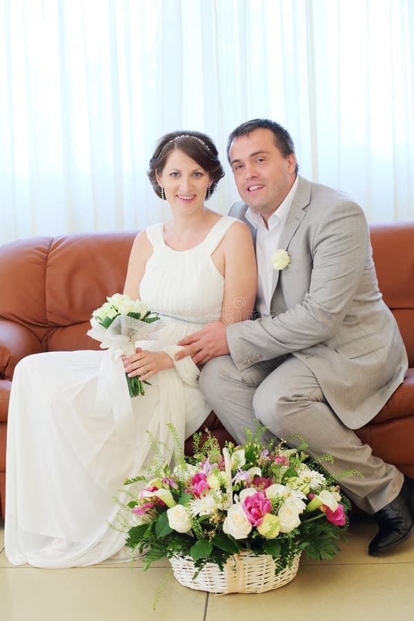 Beautiful Bride and Groom Sit on the Stock Photo - Image of basket ...
