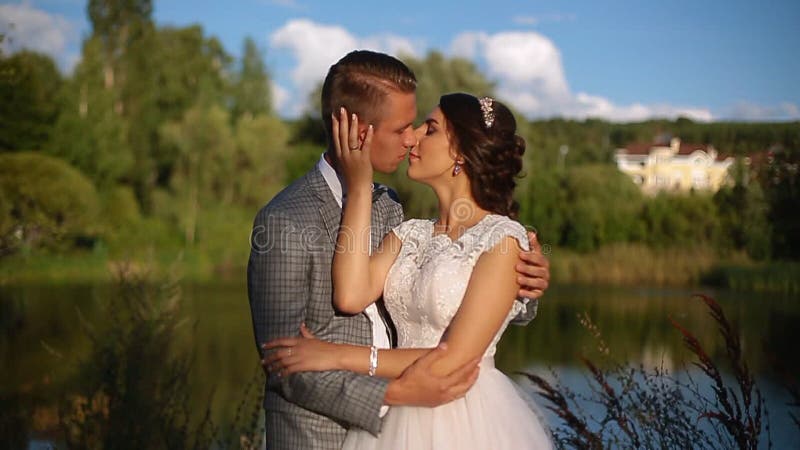 Beautiful Bride and Groom Walking in the Park before the Wedding ...
