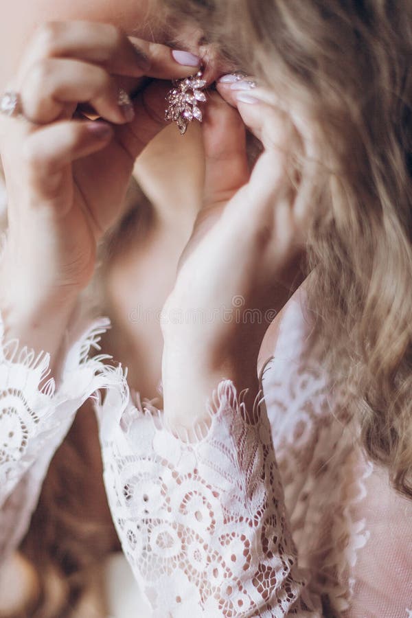 Beautiful Bride In Lace Robe Putting On Luxury Earrings Bridal Stock