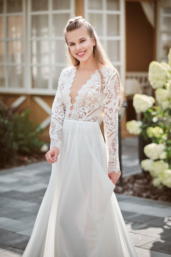 Beautiful Bride Posing in Her Wedding Day Stock Photo - Image of green ...