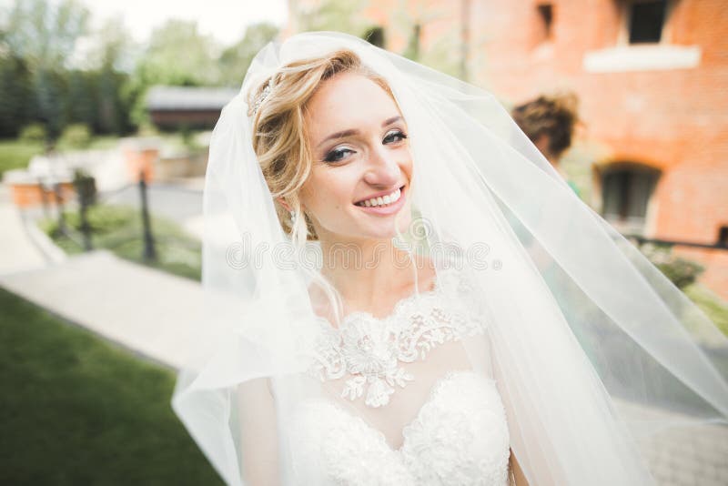 Beautiful Bride Posing in Wedding Dress Outdoors Stock Image - Image of ...
